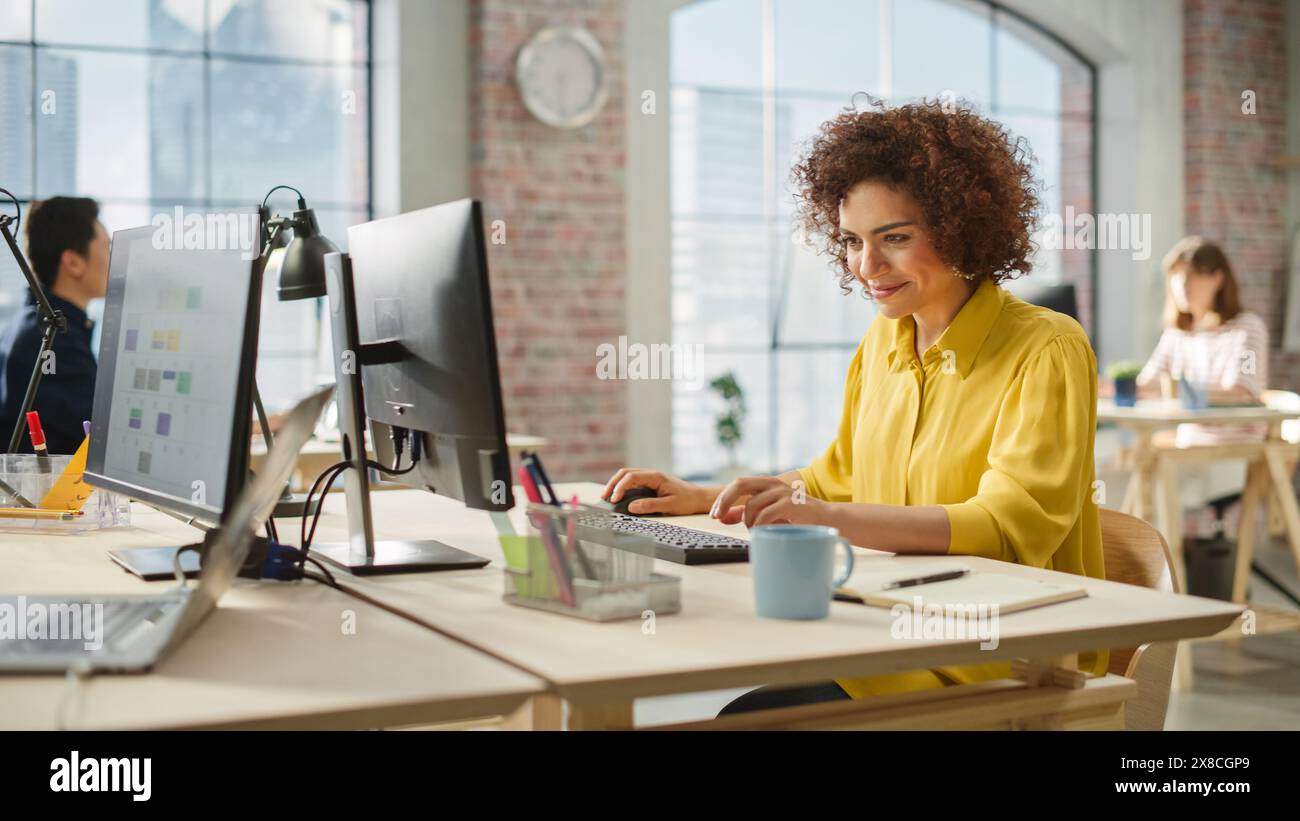 Female employee smiles happily hi-res stock photography and images - Alamy