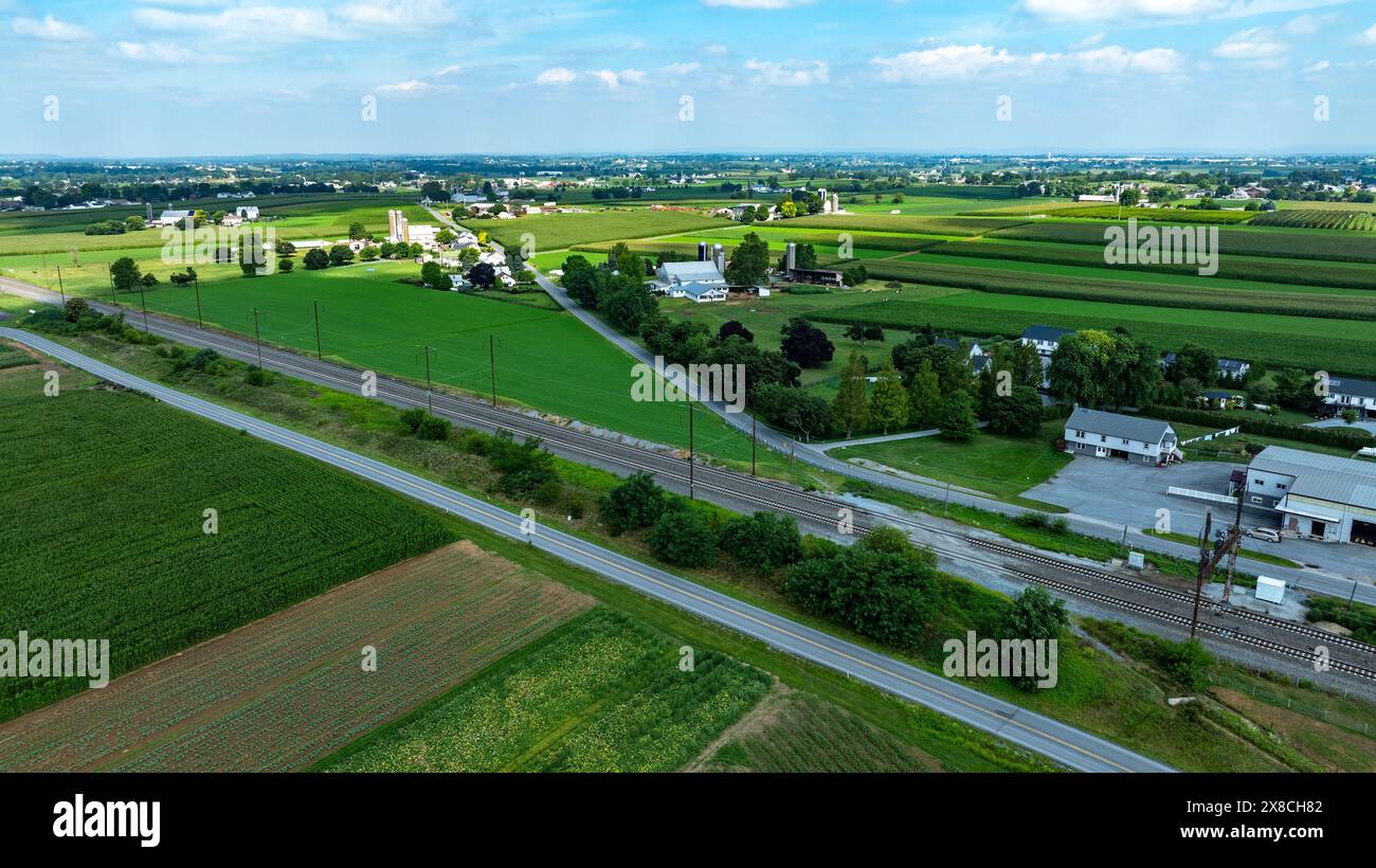 An Aerial View of Rural Community with Farmland, Roads, and Railway ...