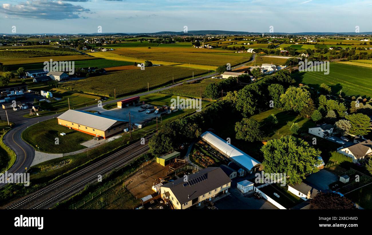 An Aerial View of Rural Community with Homes, Gardens, and Farmland ...
