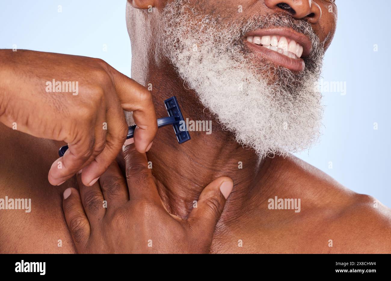 Razor, shaving and man with beard in studio for grooming, hair removal or self care treatment ...