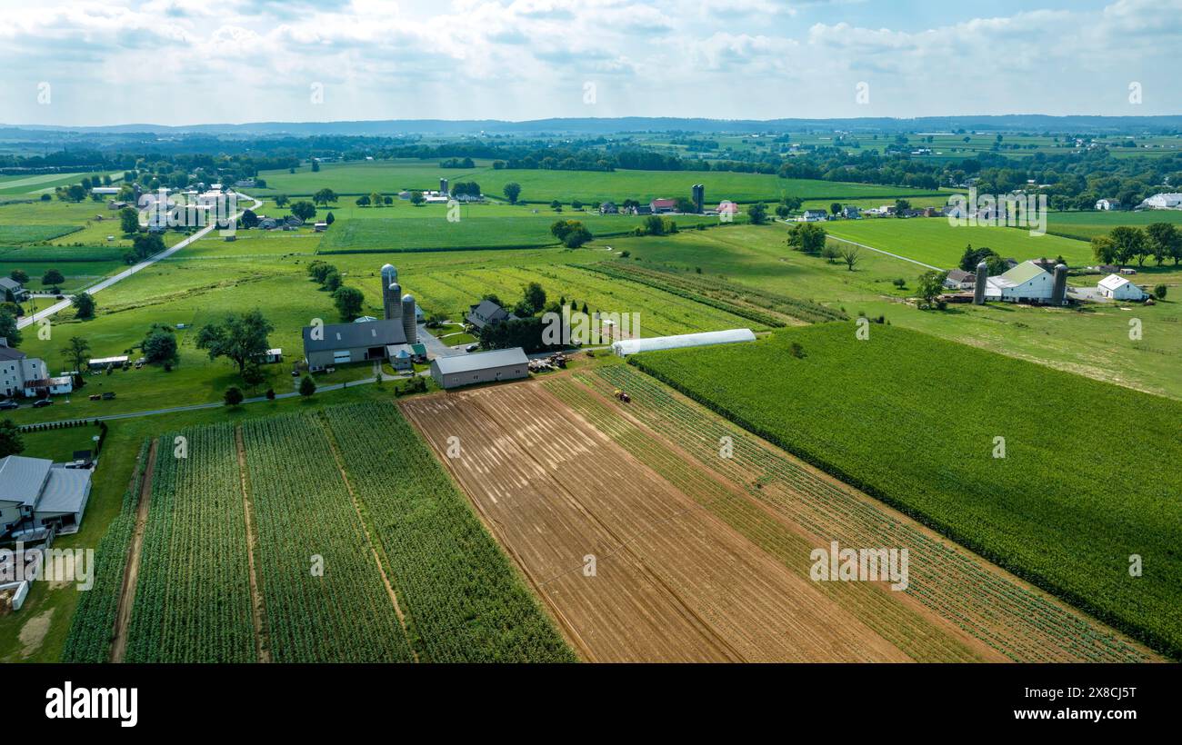 An Aerial View of Farmland with Crops, Barns, and Silos Stock Photo - Alamy