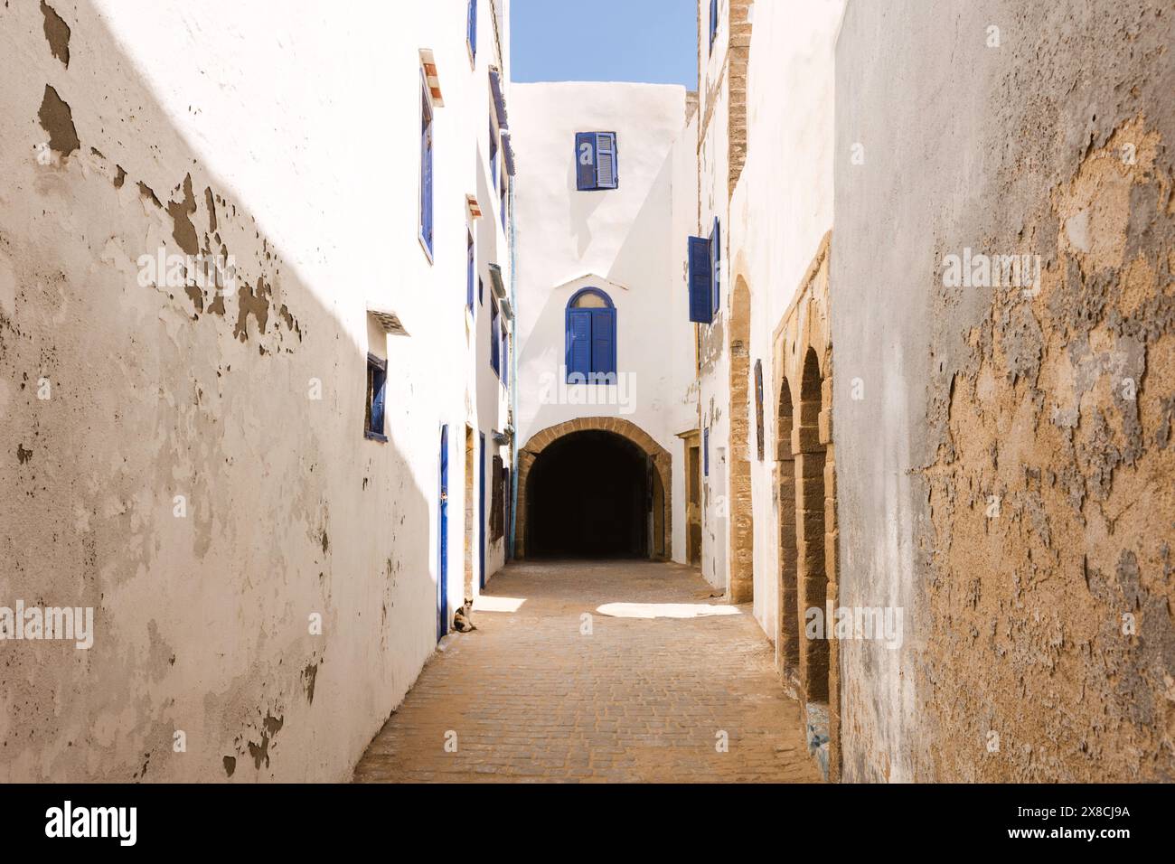 street in the ancient historical Medina, traditional white buildings ...