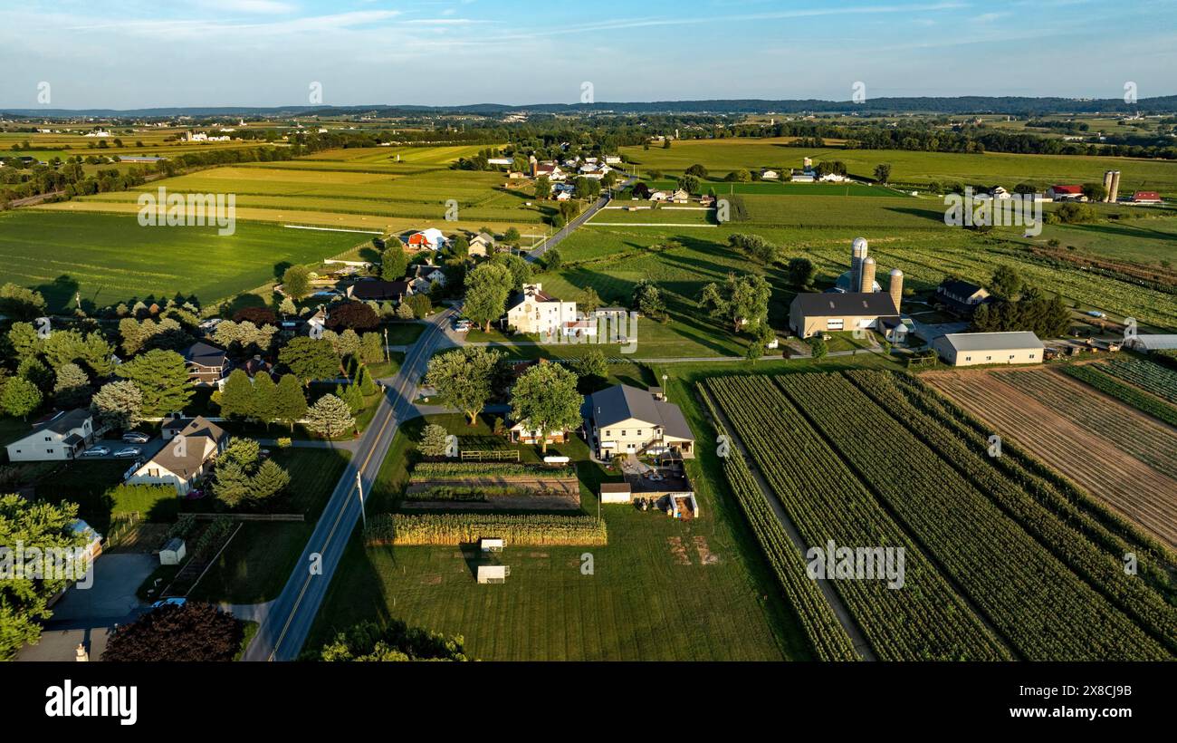 An Aerial View of Rural Community with Homes, Gardens, and Farmland ...
