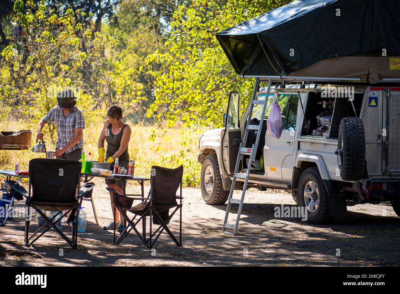Setting up camp with a 4x4 jeep with pop-up tent, on a self drive ...