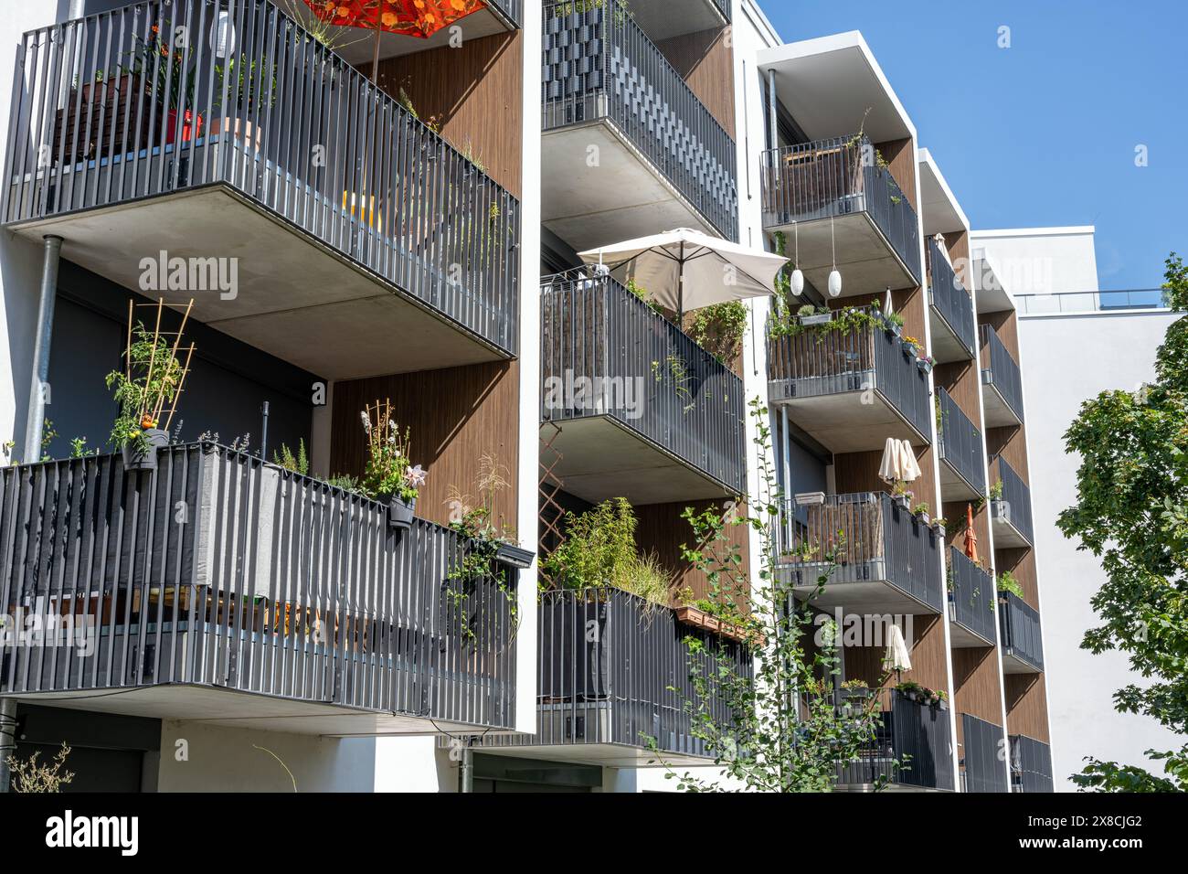 Facade with balconies of a modern apartment building seen in Berlin ...