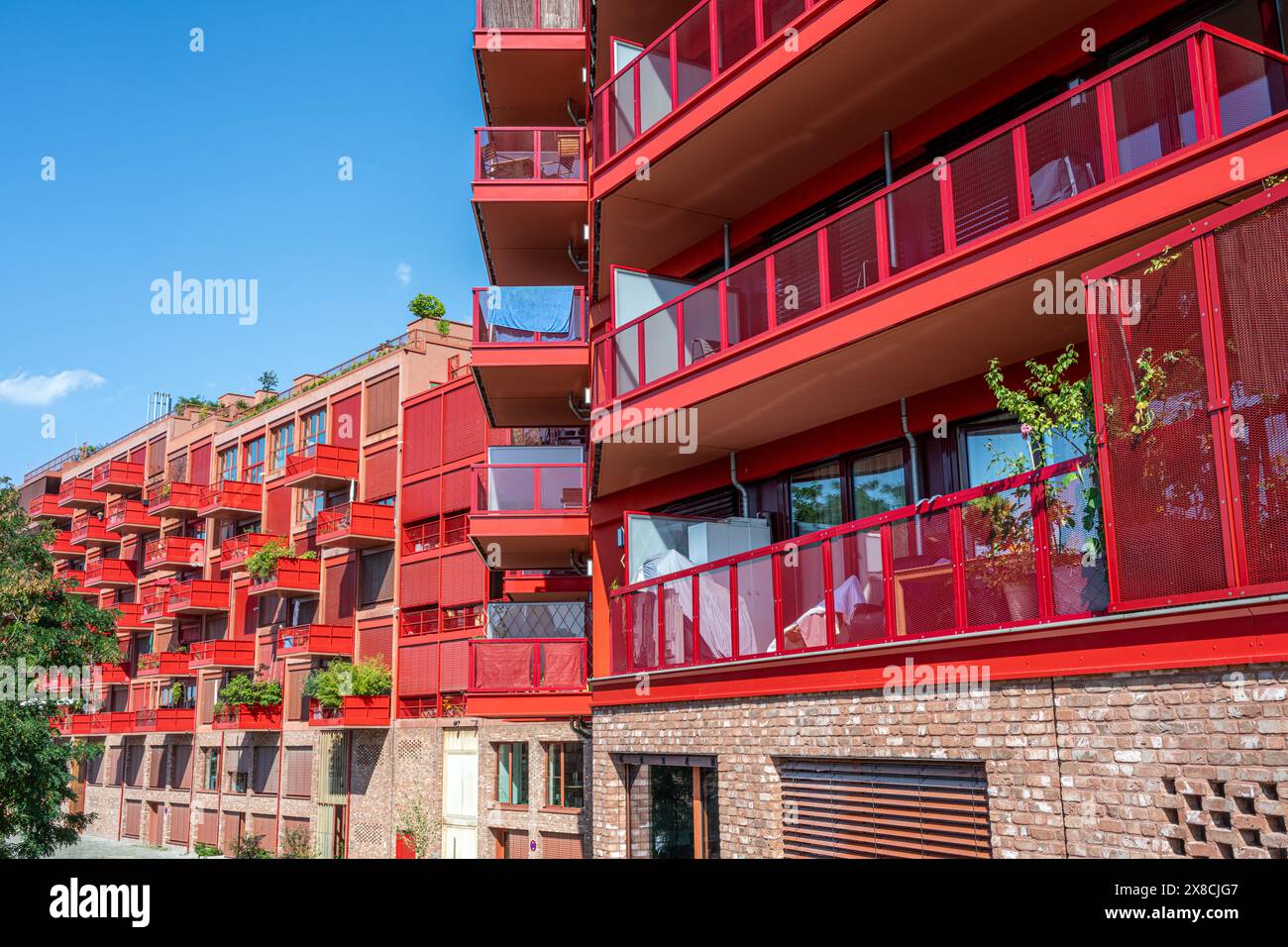 Modern red apartment buildings seen in Berlin, Germany Stock Photo - Alamy