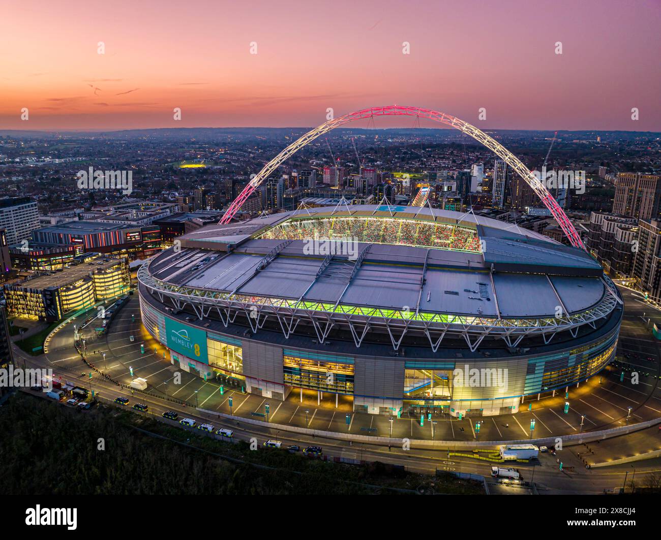 Wembley Stadium with arch lit up in Red and White to support the ...