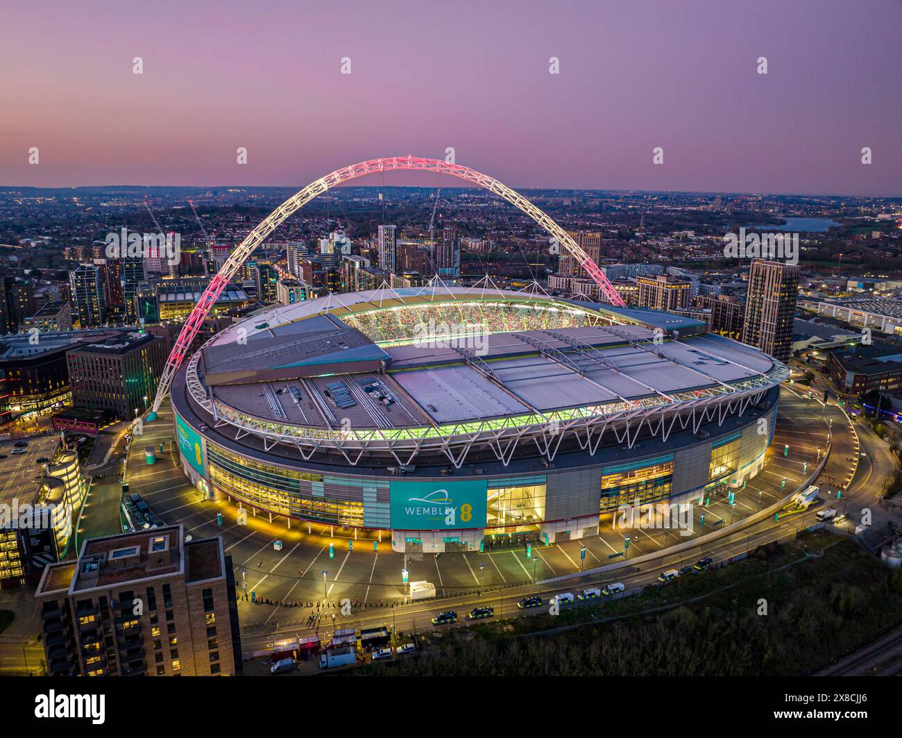 Wembley Stadium with arch lit up in Red and White to support the ...