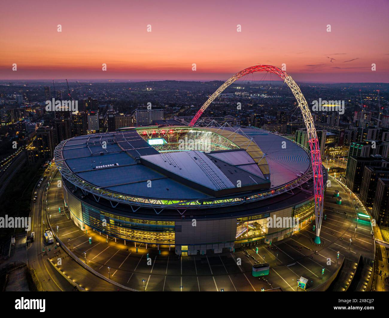 Wembley Stadium with arch lit up in Red and White to support the ...