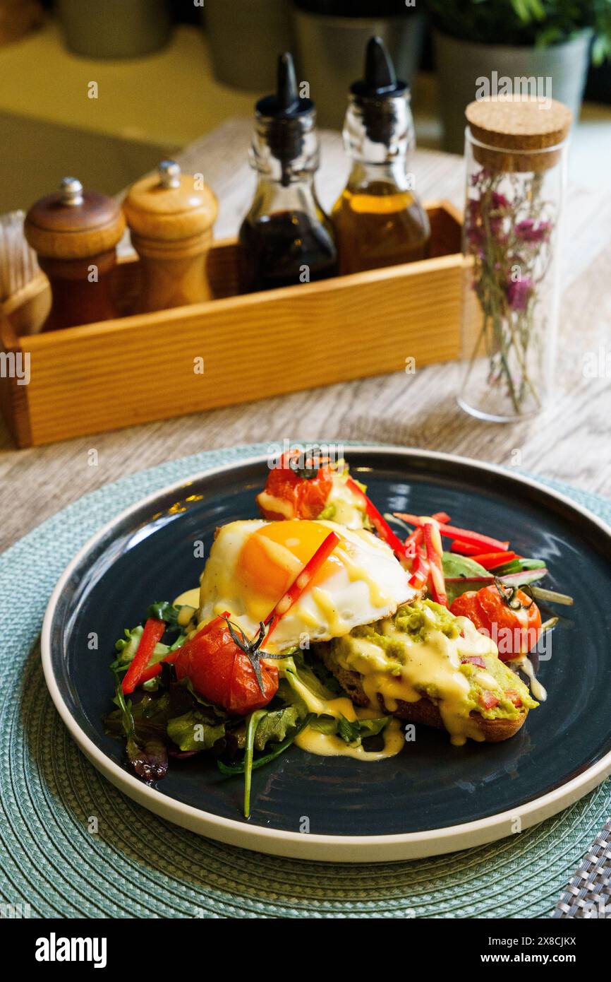 Top down of Avocado toast with fried eggs and vegetables Stock Photo ...