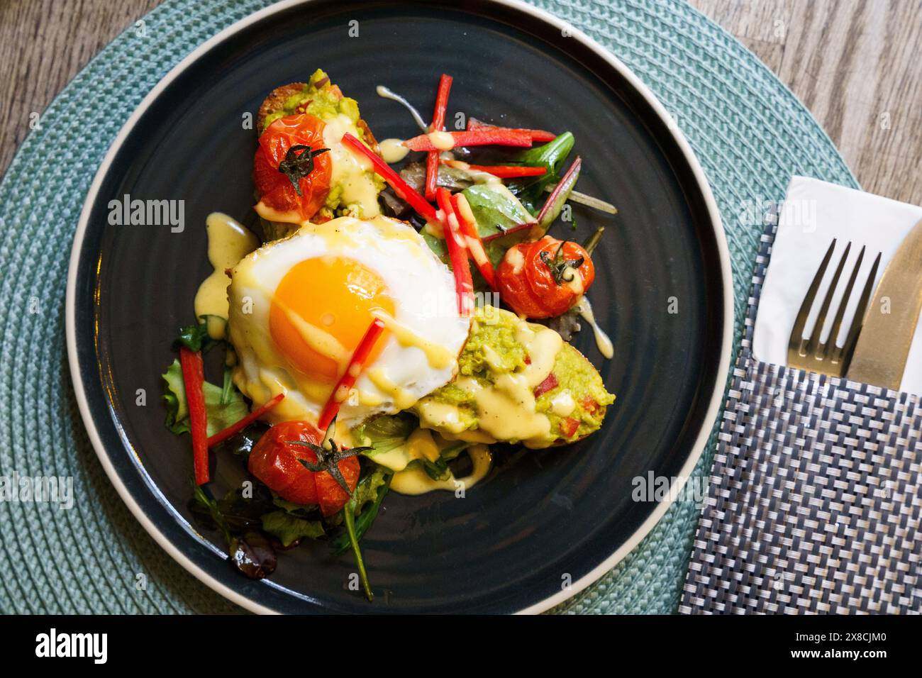 Top down of Avocado toast with fried eggs and vegetables Stock Photo ...