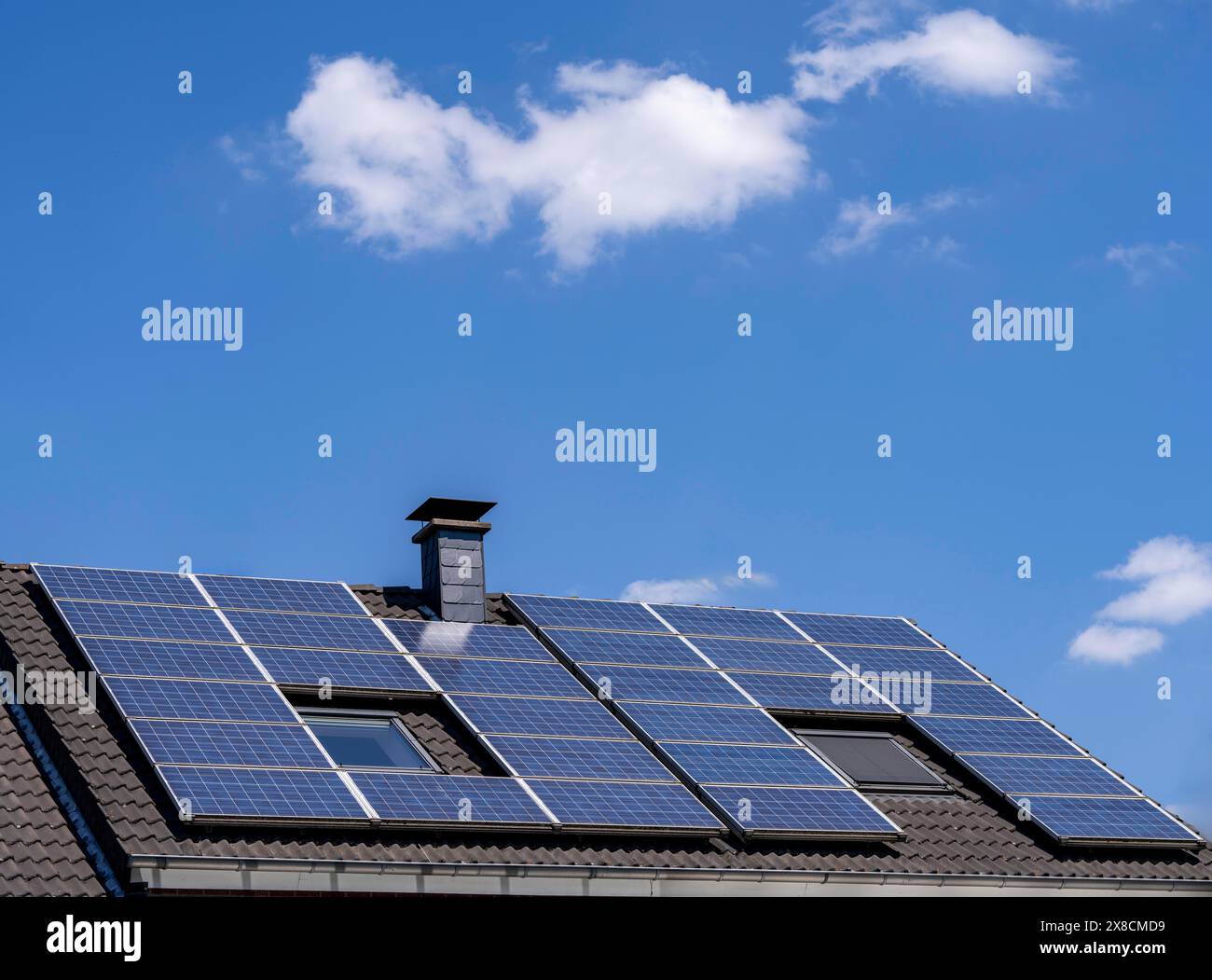 Solar system on the pitched roof of a residential building ...