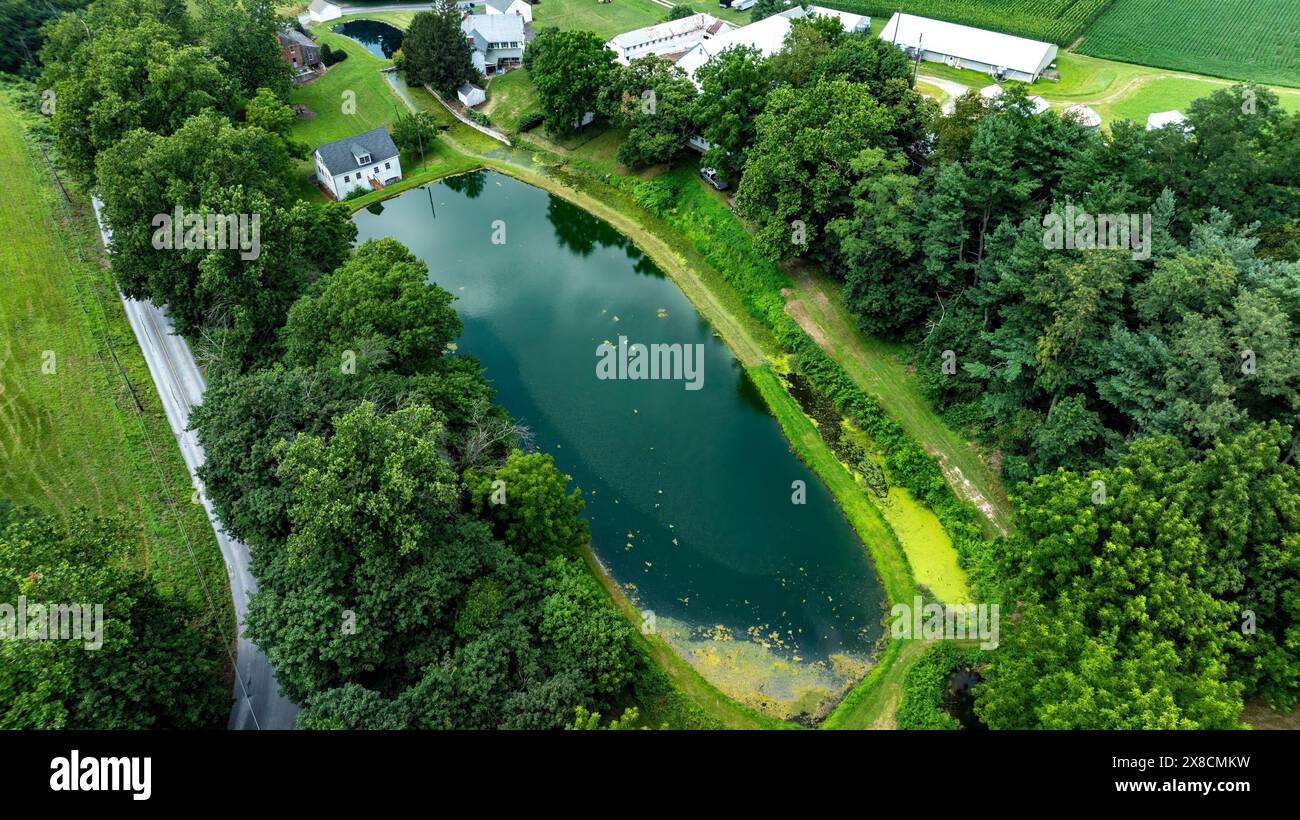 An Aerial View of a Rural Farm with Pond and Trees Stock Photo - Alamy