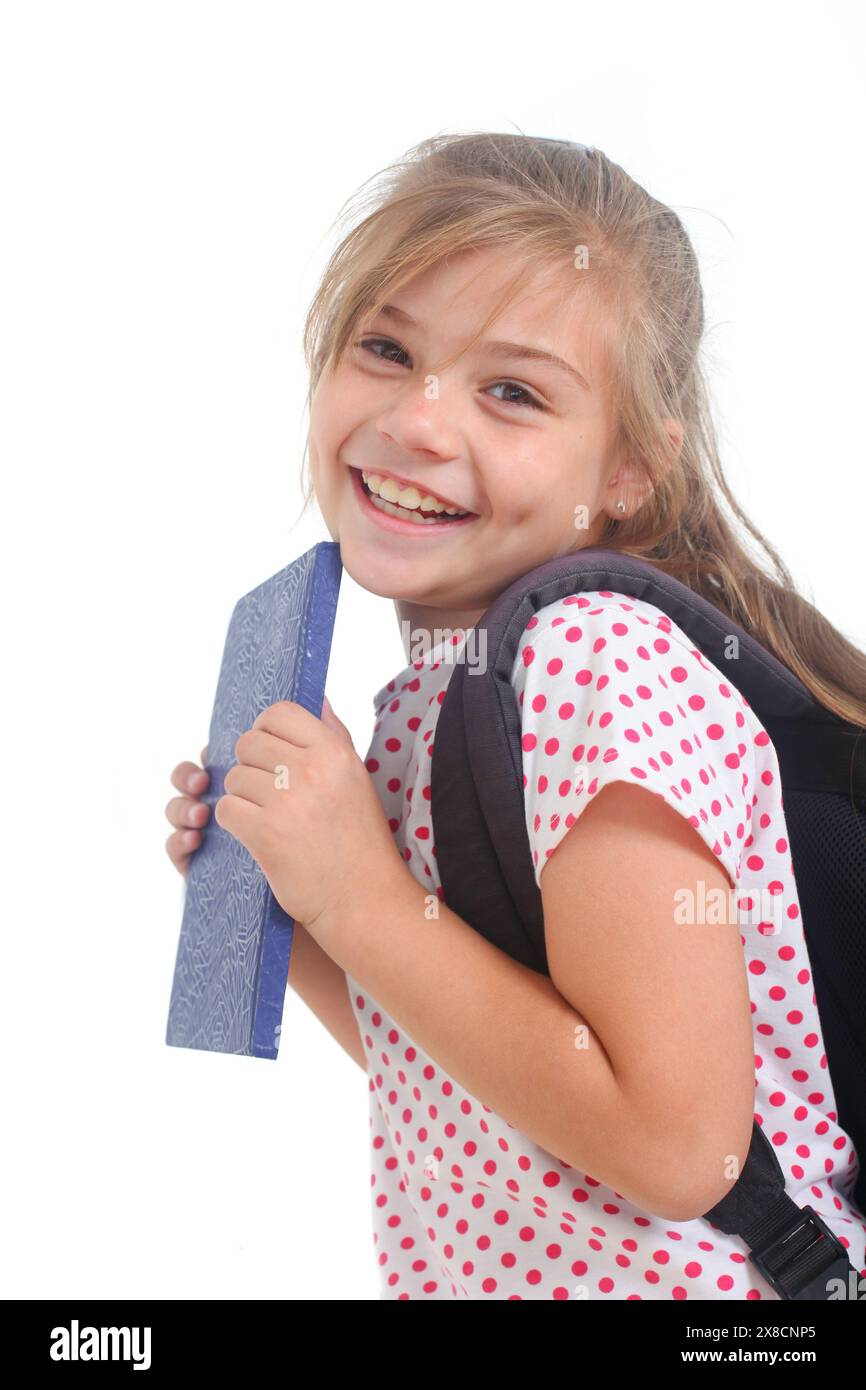 cheerful elementary schoolgirl on white background Stock Photo - Alamy