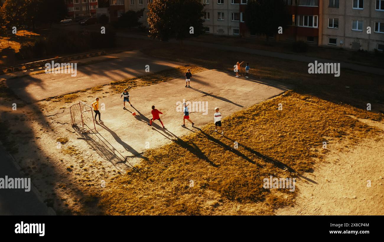 Aerial Drone Taking Off Shot of Neighborhood Friends Playing Soccer ...