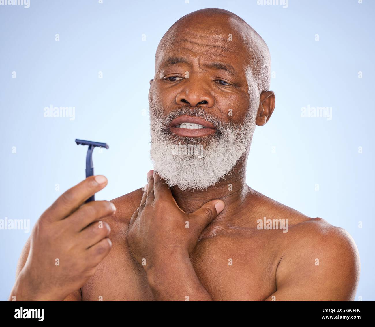 Pain, shaving and black man with razor for beard in studio for grooming, hair removal or self ...