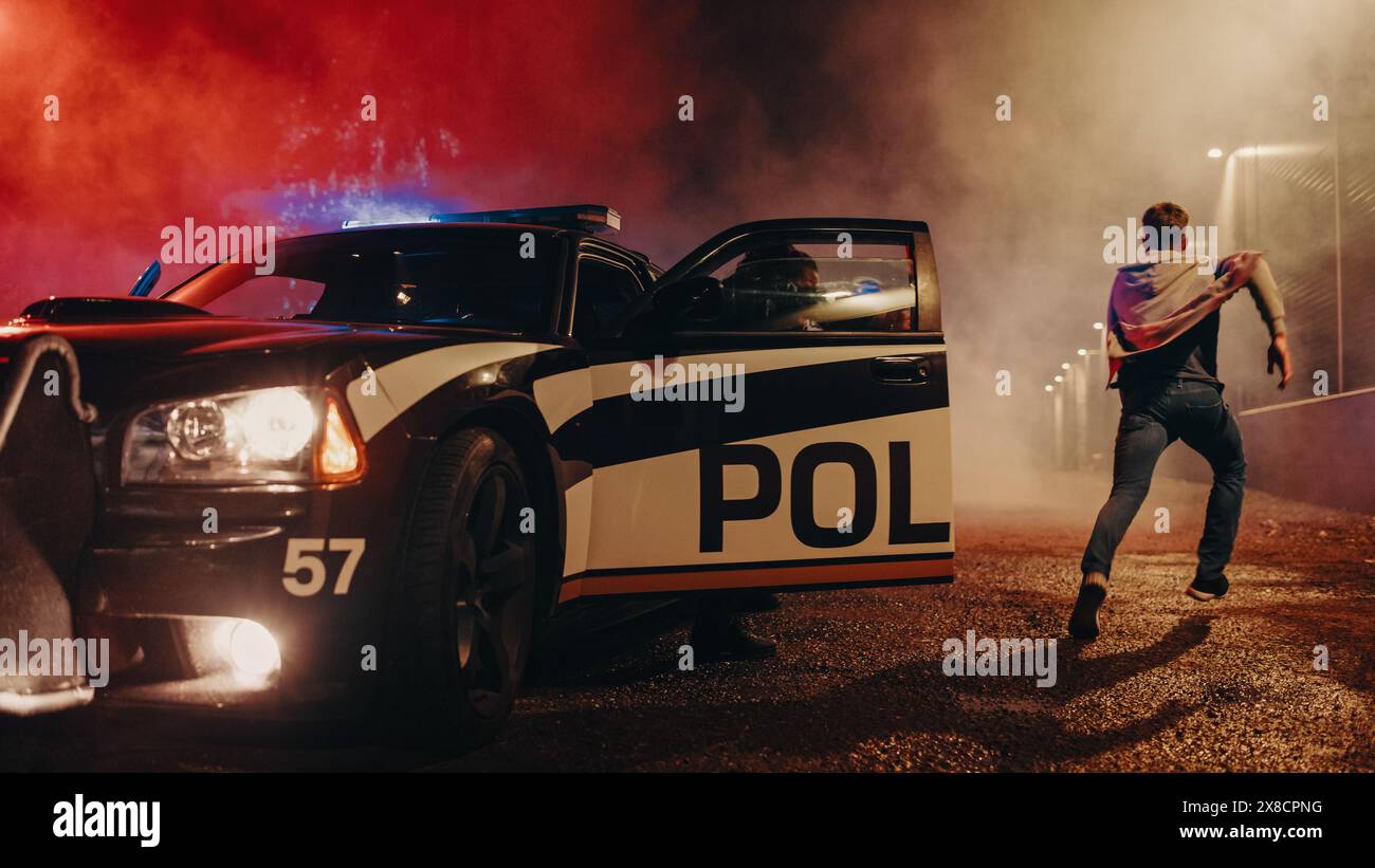 Police Officers Attempting to Arrest a Fleeing Criminal. Cops in ...