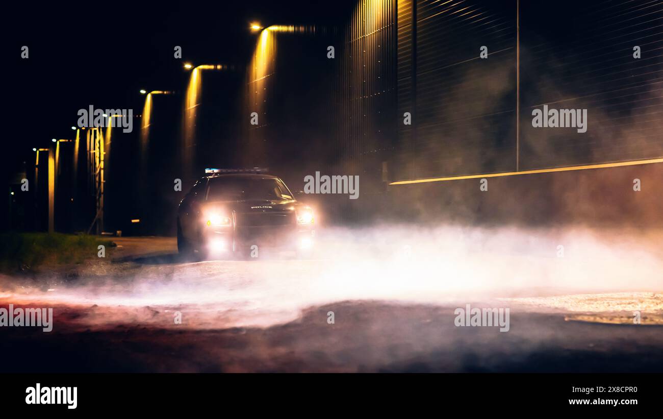 Police Officers in Patrol Car Cruising Seedy Streets of a City Ready to ...