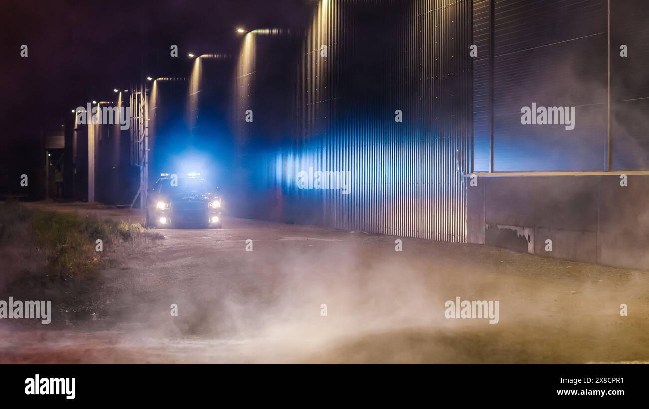 Police Officers in Patrol Car Driving through Dark Streets of a City ...