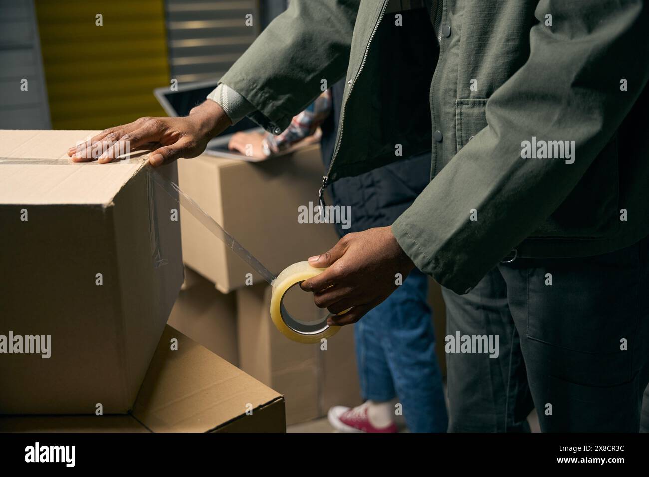 Team of warehouse workers preparing cargo for shipping Stock Photo - Alamy