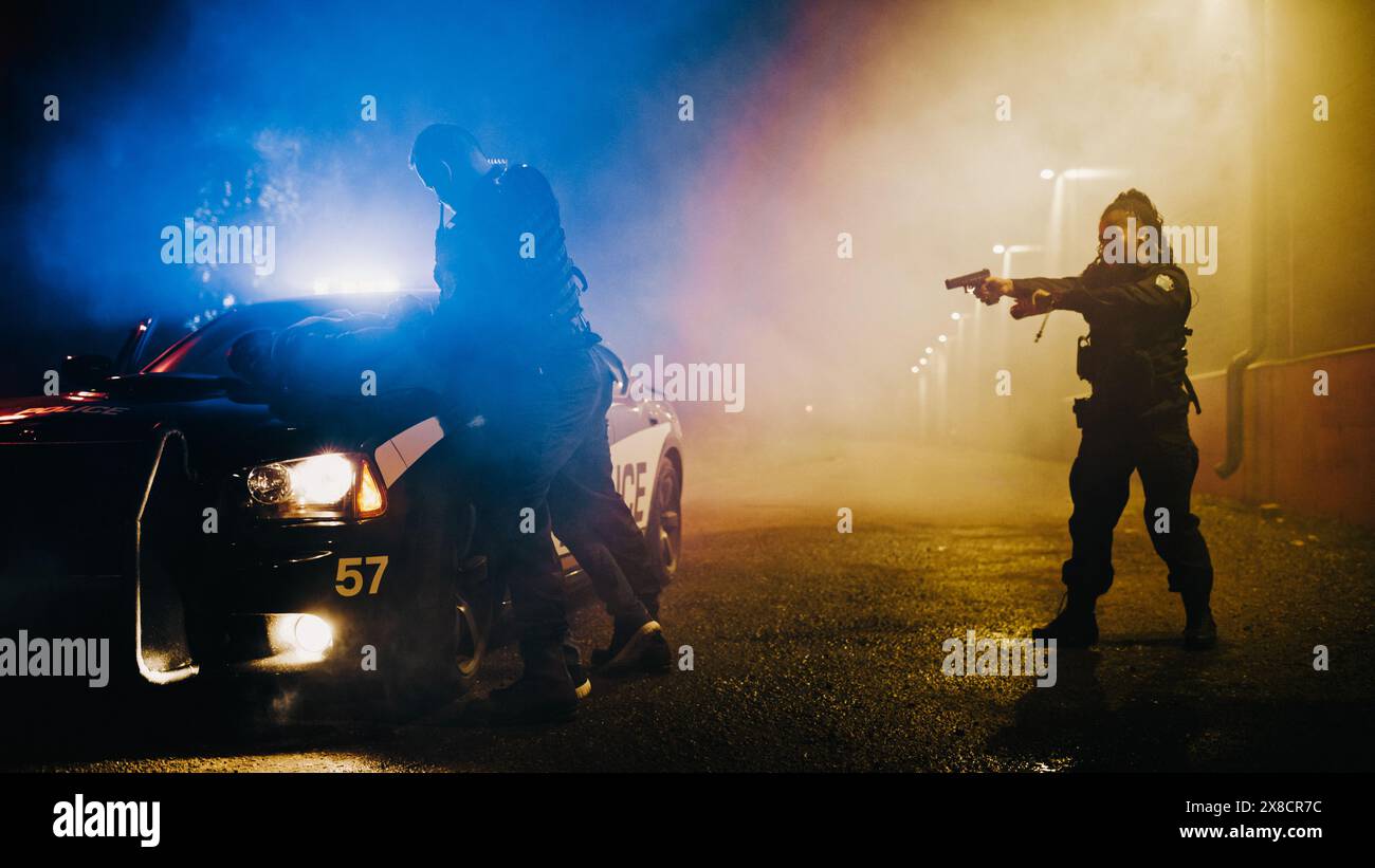 Male Policeman Forcing a Dangerous Criminal on the Hood of Police Car ...