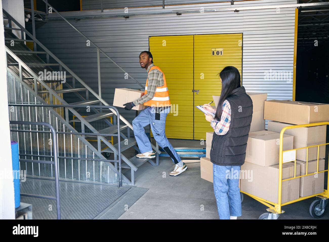 Team of warehouse coworkers involved in freight handling Stock Photo ...