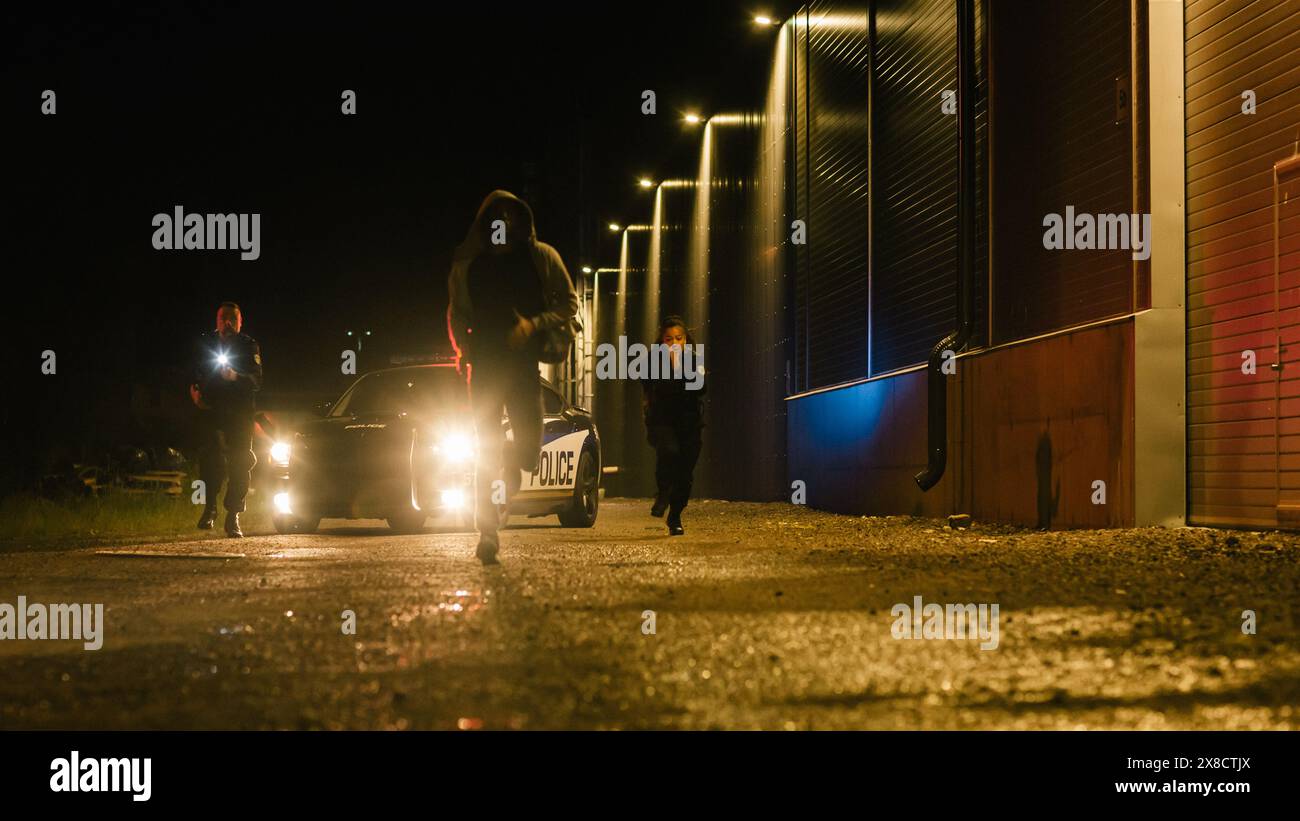 Two Police Officers in Pursuit of a Suspect. Cops Getting out of the ...