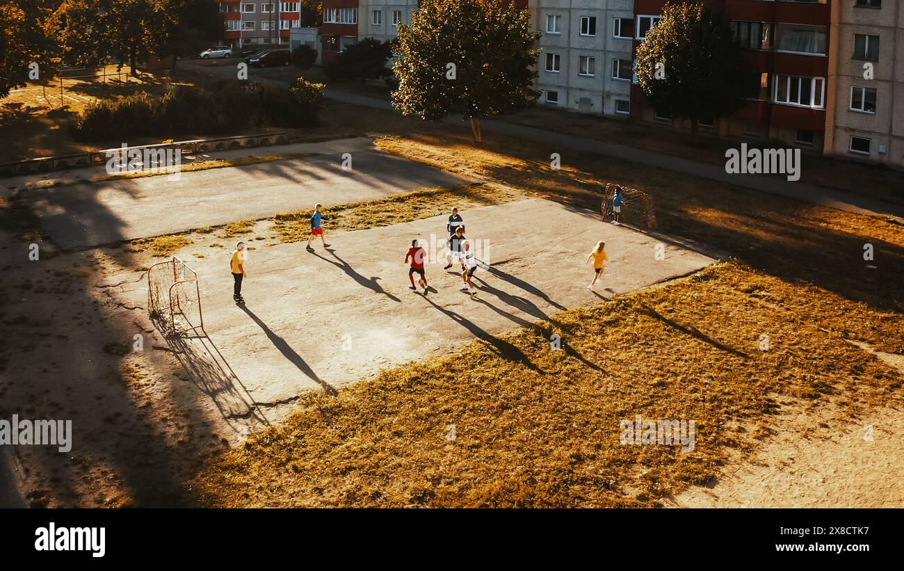 Aerial Drone Shot of Neighborhood Friends Playing Soccer Outside in ...