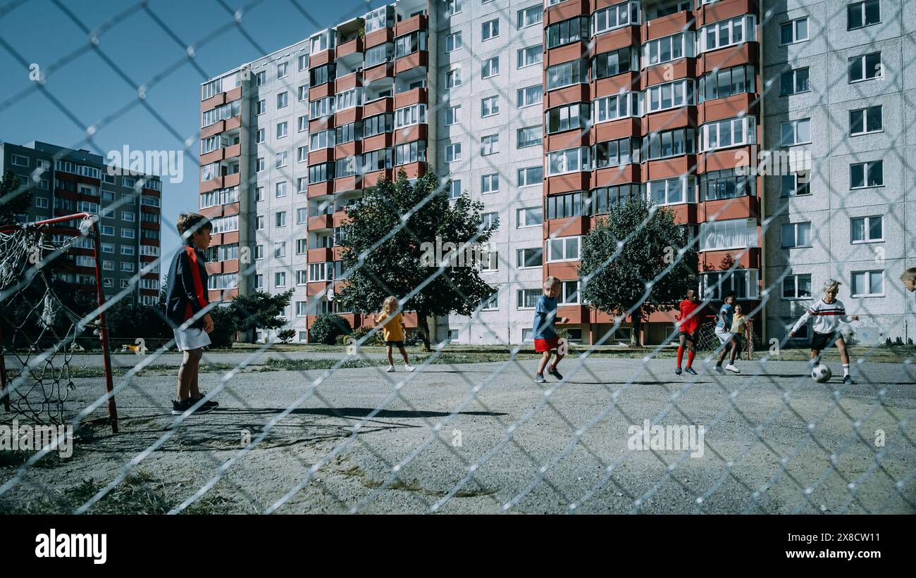 Neighborhood Kids Playing Soccer Outside in Urban Backyard. Young ...