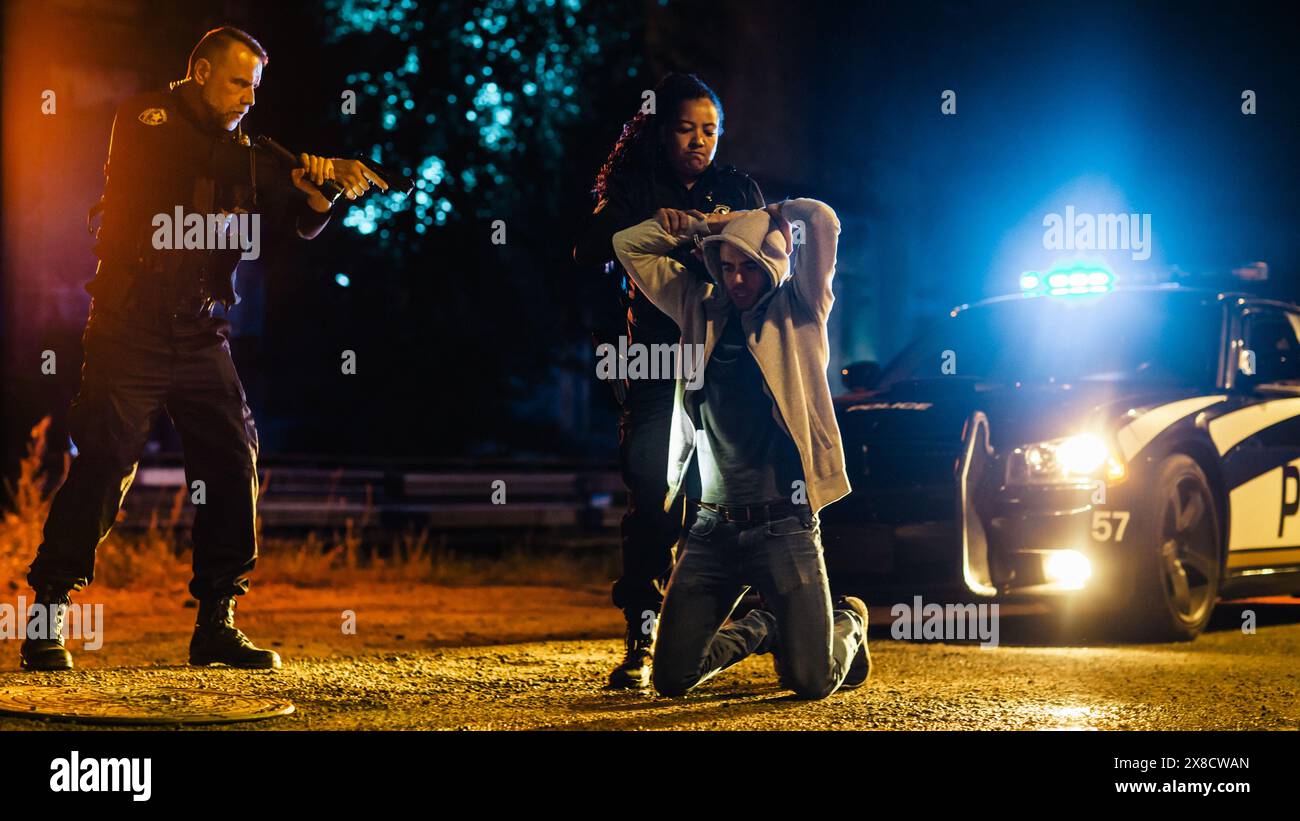 Black Female Police Officers Handcuffing a Compliant Suspect While her ...