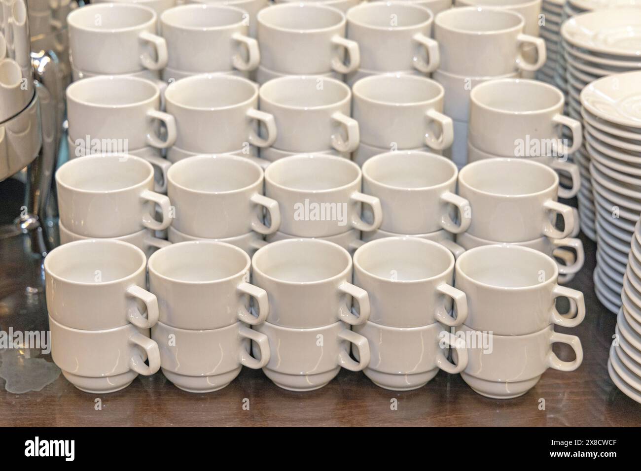 Stack of Empty Clean White Ceramic Mugs at Table Stock Photo - Alamy