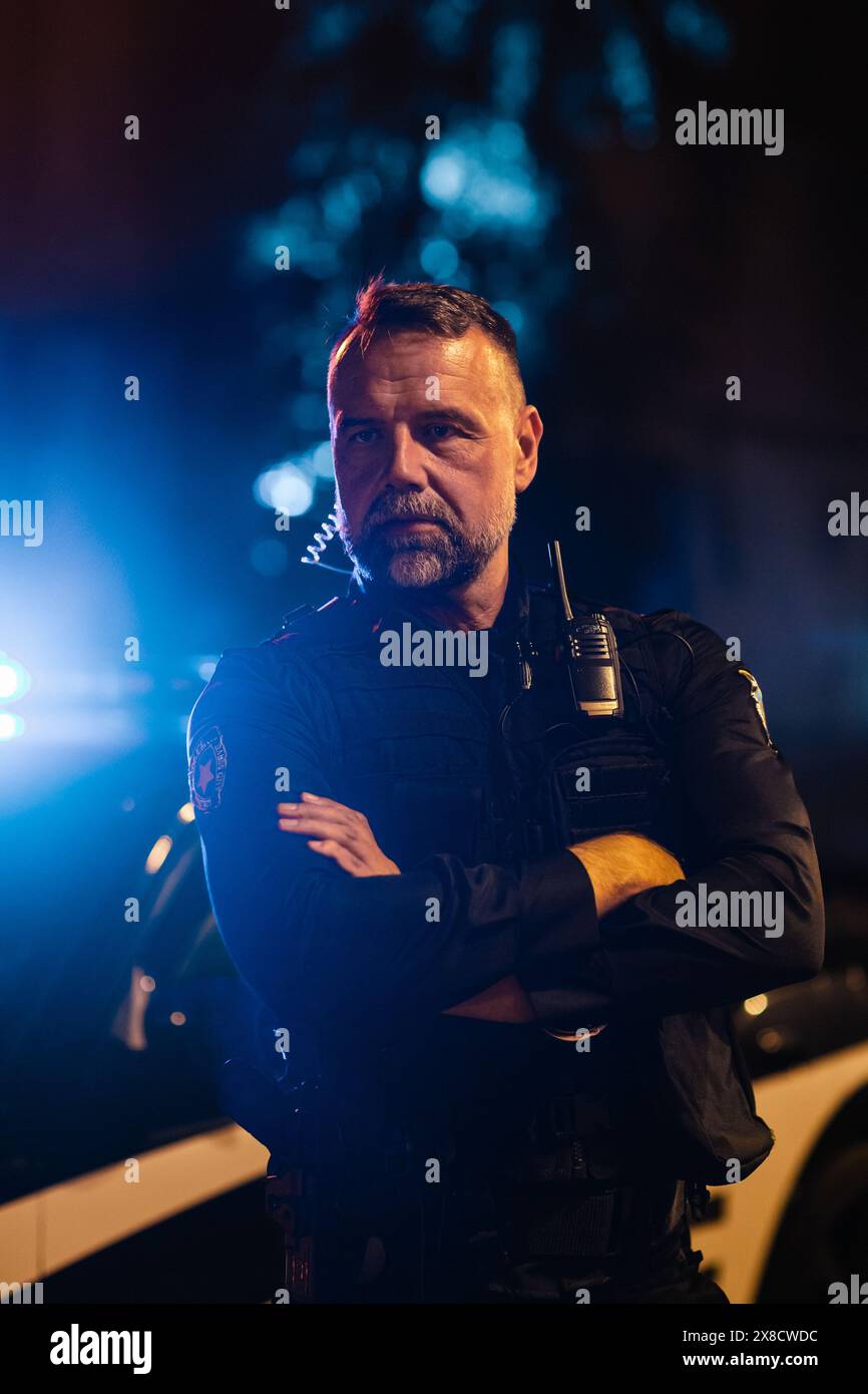 Professional Police Officer with Crossed Arms Watching Over a Public ...