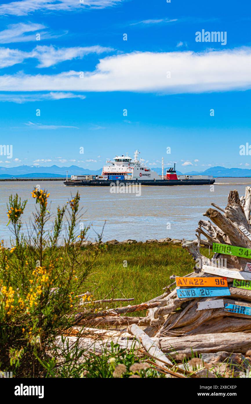 Truck ferry arriving in the Fraser River estuary in British Columbia ...