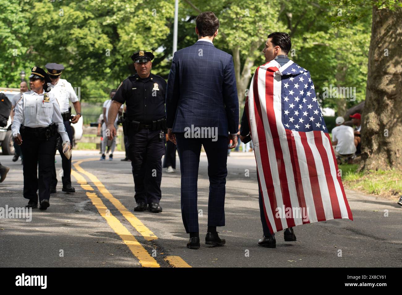 Bronx, United States. 23rd May, 2024. A man wearing an American flag in ...