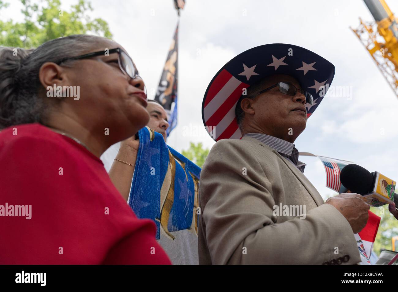 Bronx, United States. 23rd May, 2024. A man wearing an American flag ...