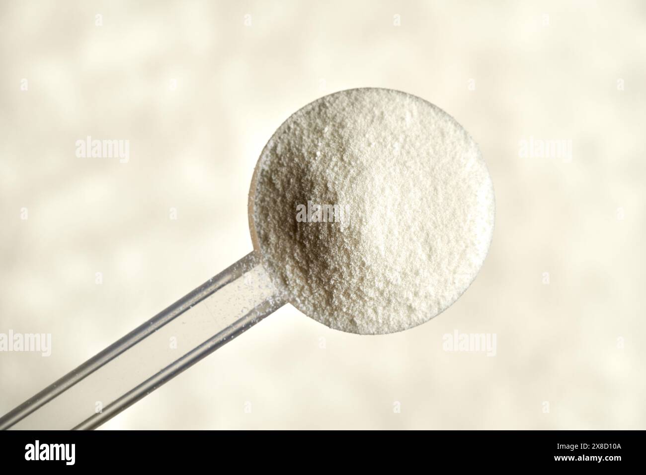 Collagen powder in a plastic measuring scoop, top view Stock Photo - Alamy