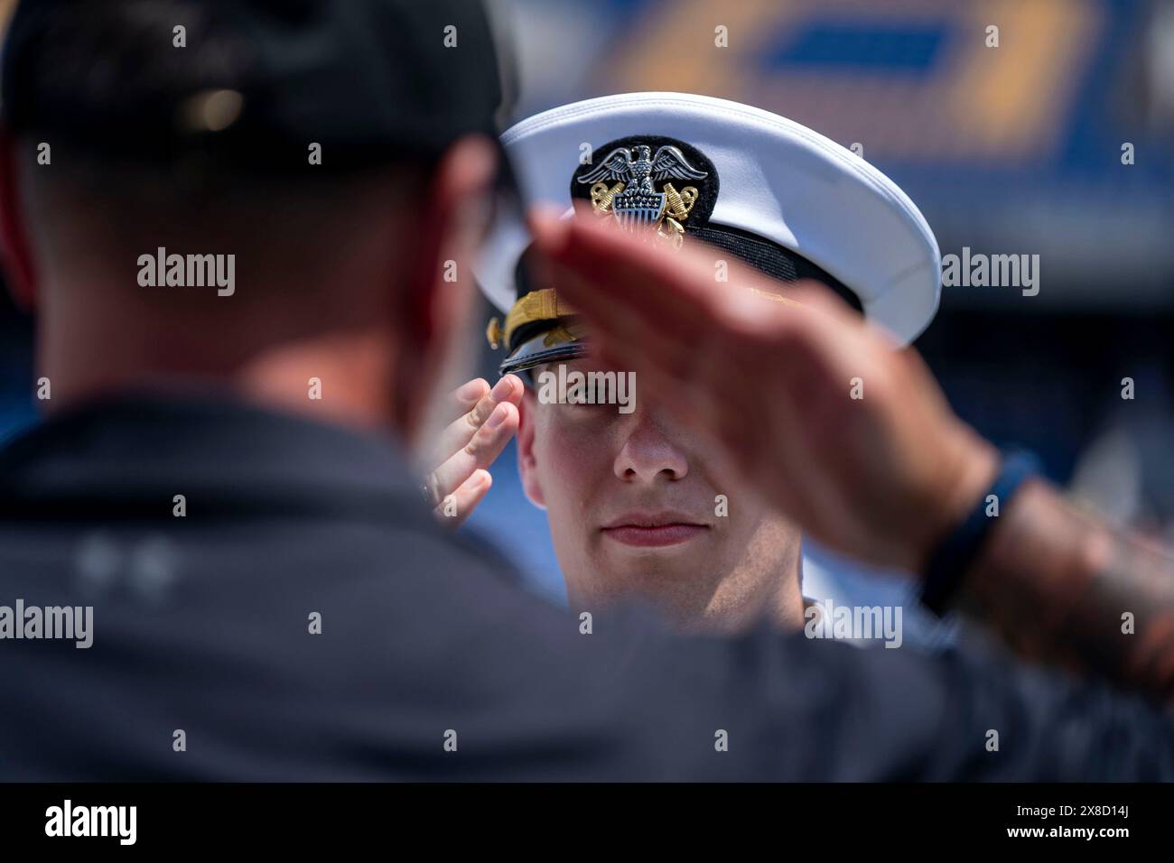 Annapolis, United States. 24th May, 2024. A father salutes his son, a ...