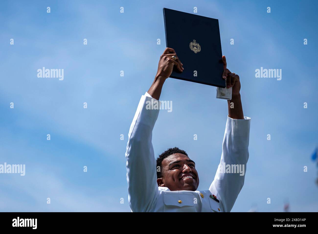 Annapolis, United States. 24th May, 2024. A graduating midshipman holds ...