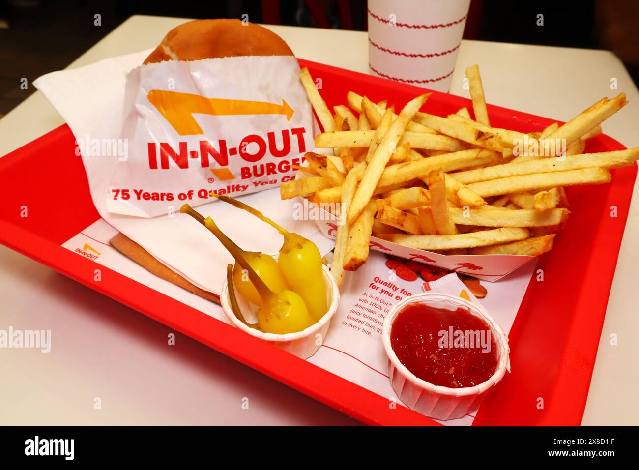 IN-N-OUT Burger, Hamburger and French Fries in a tray on the table ...
