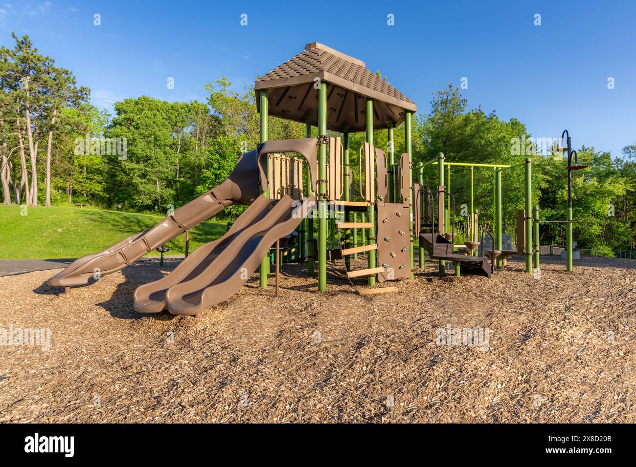 Unidentified typical elementary school, municipal park, playground with ...