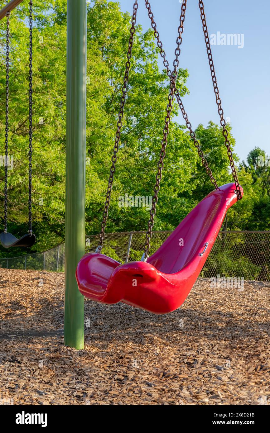 Accessible swing, chair, in a typical elementary school, municipal park ...