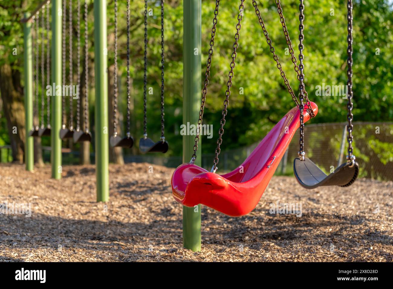 Accessible swing, chair, in a typical elementary school, municipal park ...