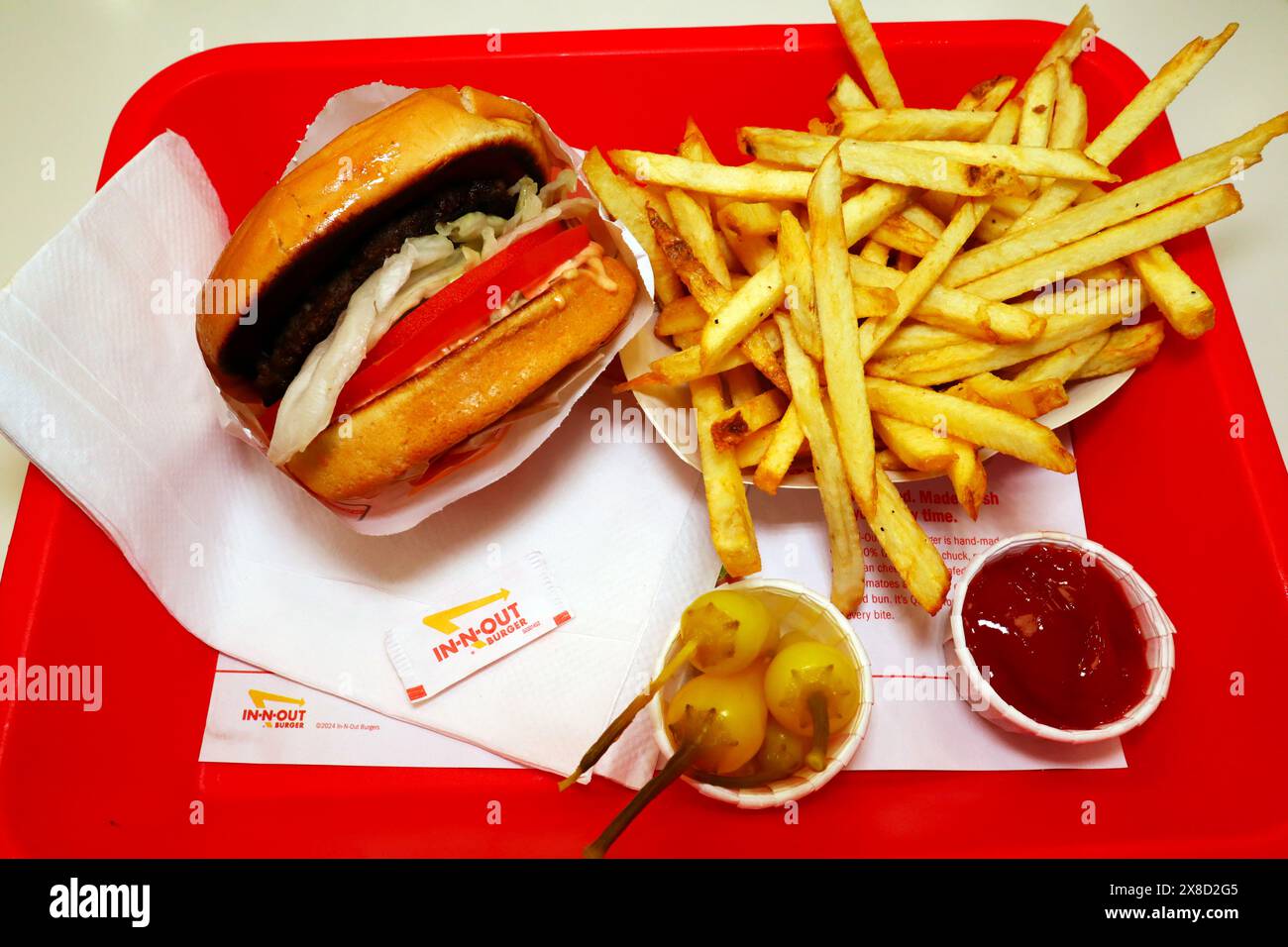 IN-N-OUT Burger, Hamburger and French Fries in a tray on the table ...