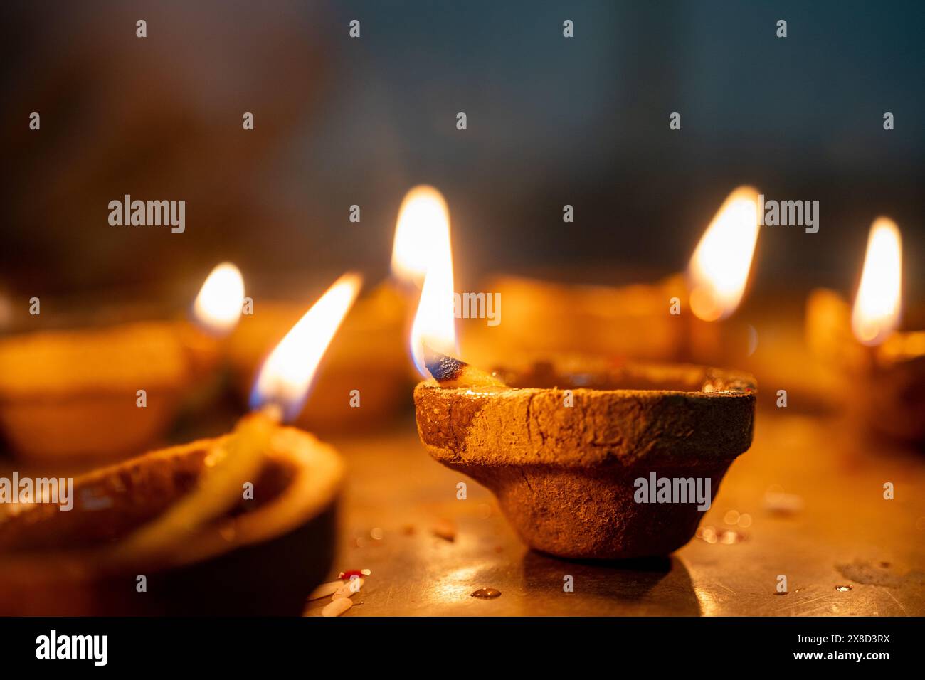 Organic diya lamps made from coconut fiber filled with oil and lit to ...