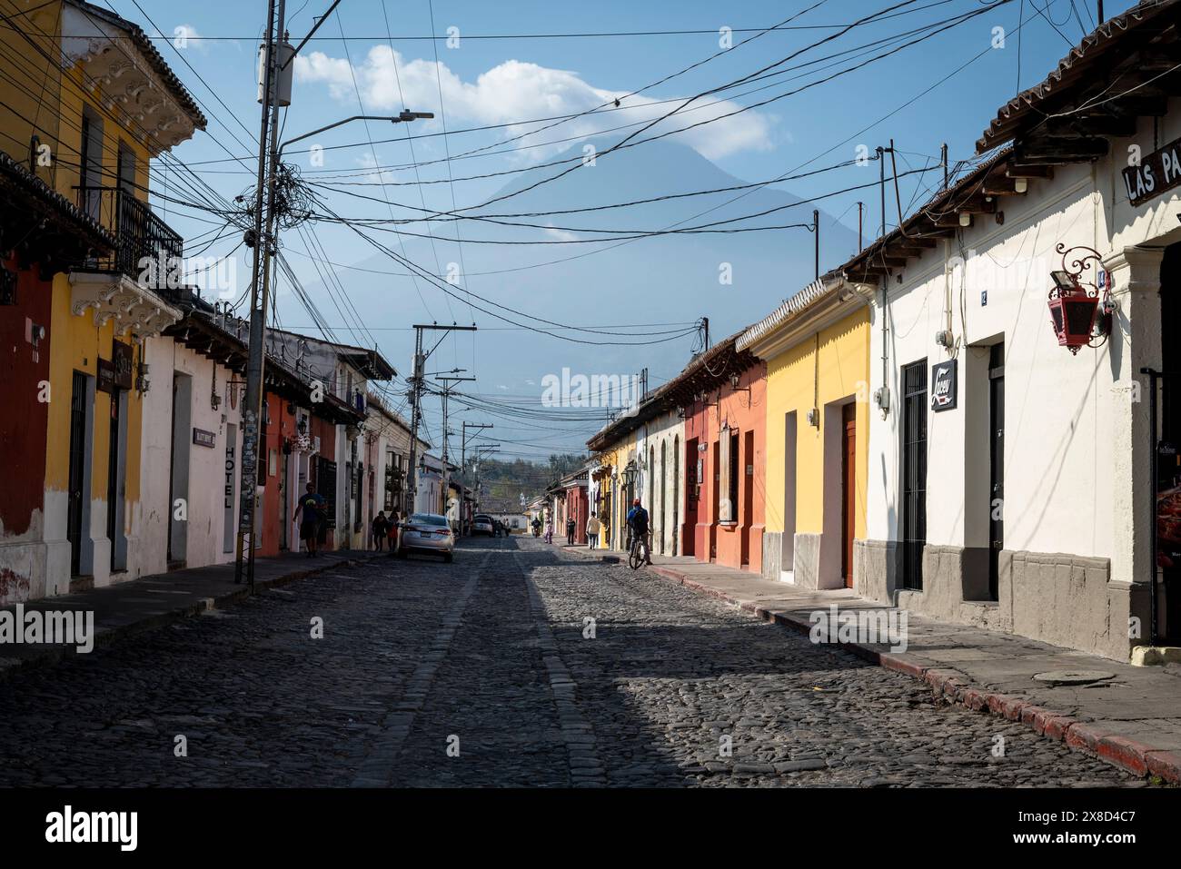 Cobblestone street and Spanish colonial-style architecture with Water ...
