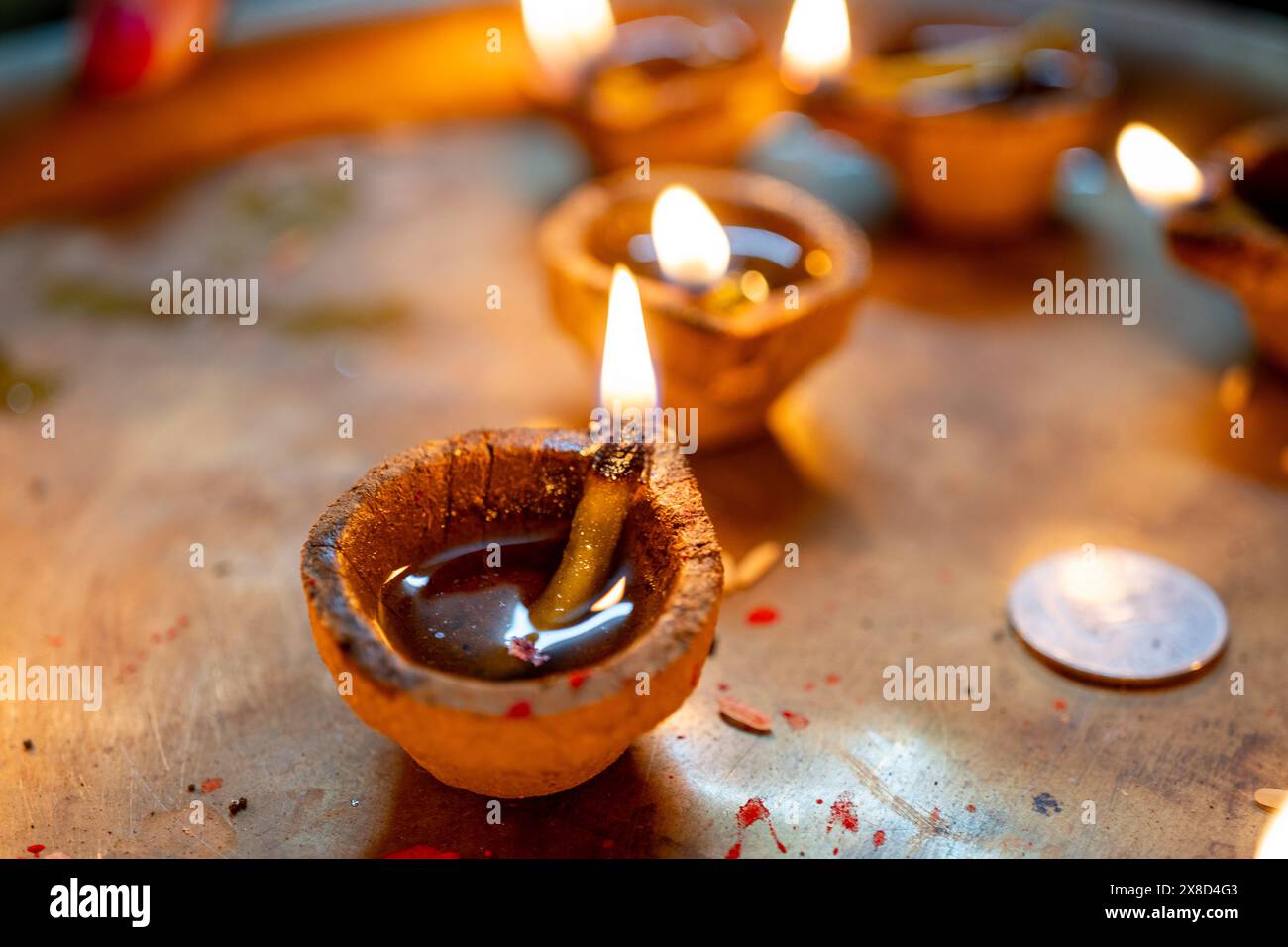 Organic diya lamps made from coconut fiber filled with oil and lit to ...
