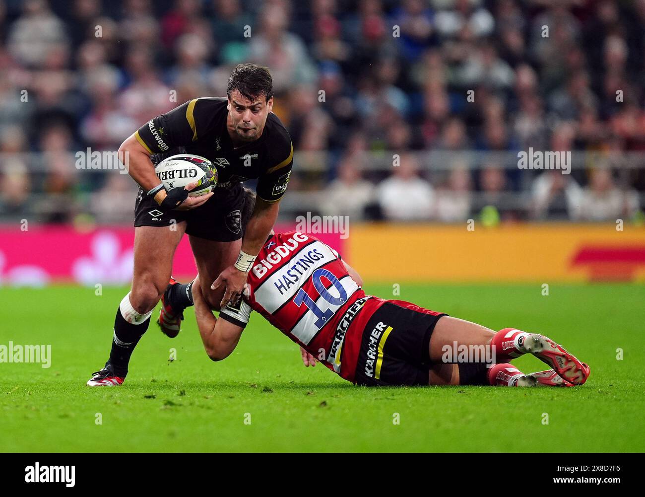 Hollywoodbet Sharks' Francois Venter is tackled by Gloucester Rugby's ...