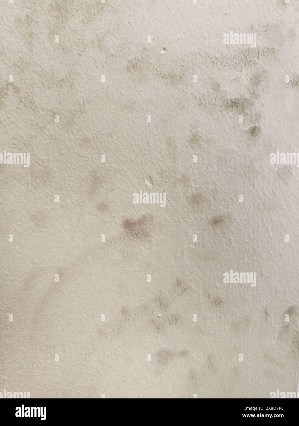 A dirty wall with marks and smudges, fingerprints and dirt marks on a ...