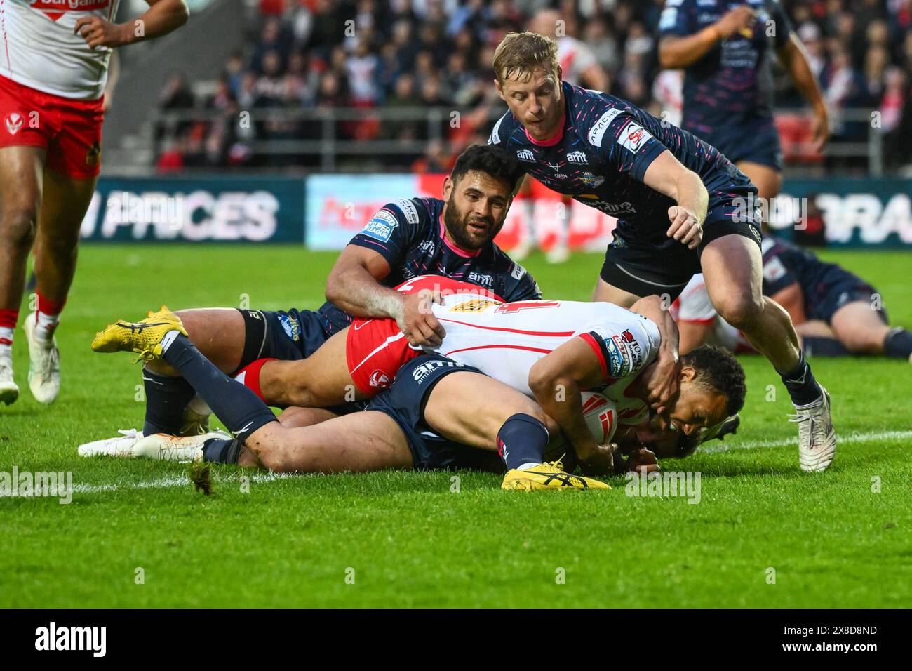 Moses Mbye of St. Helens goes over for a tryduring the Betfred Super ...