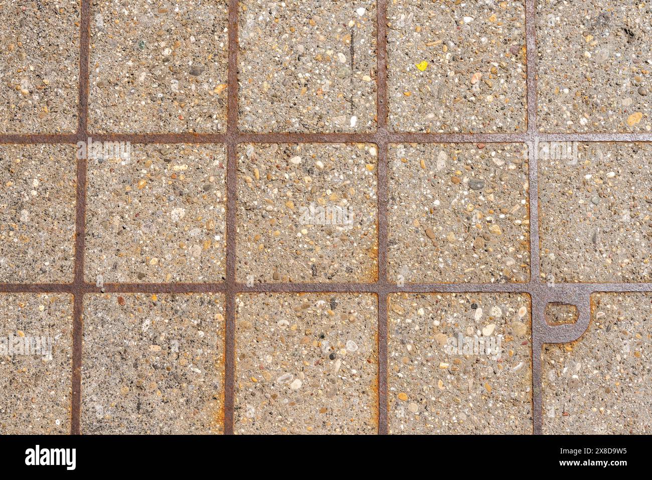 Close up of concrete lid to underground structure with metal grid to ...